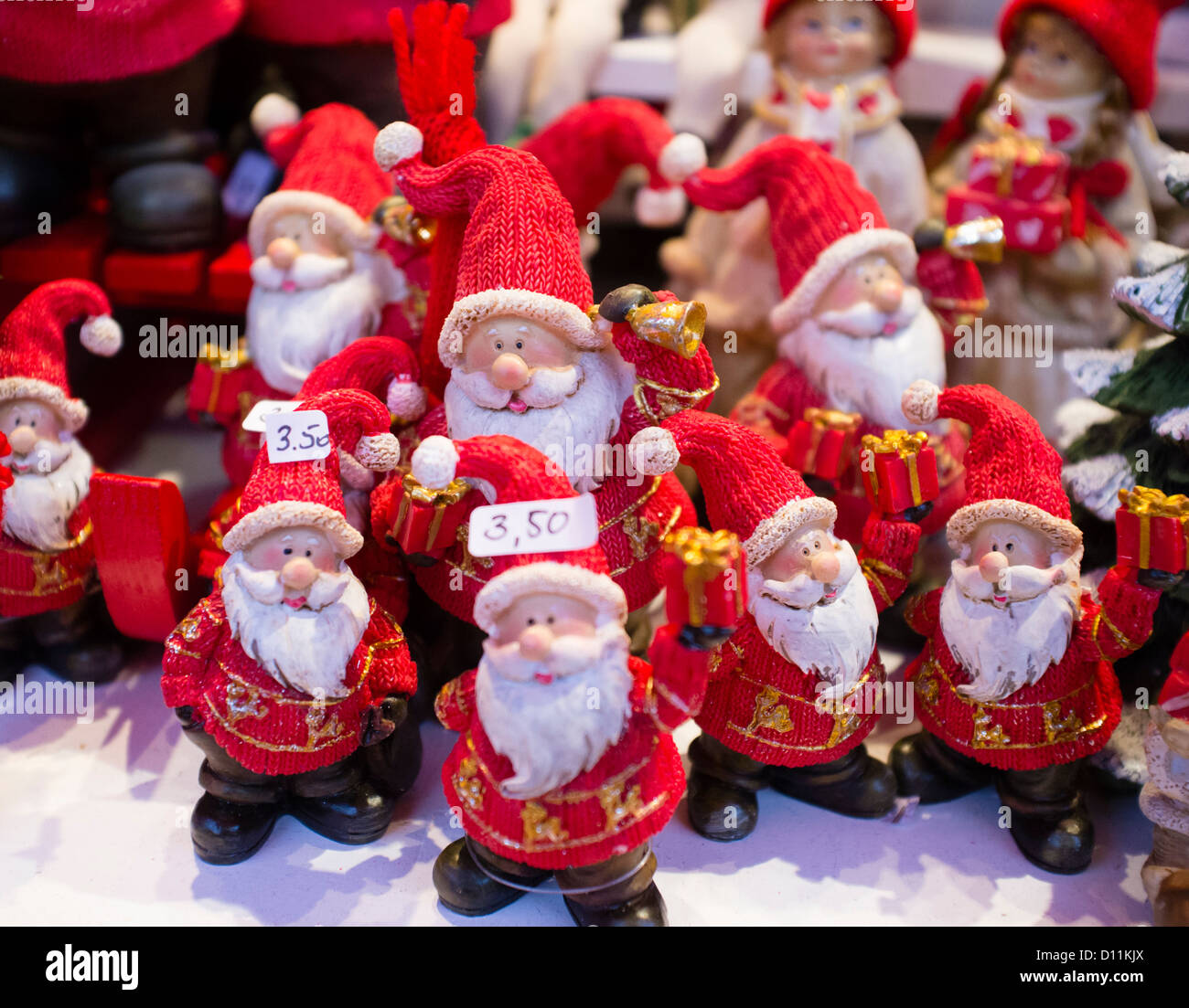 Detail of traditional wooden carved santa figures on craft stall shop ...