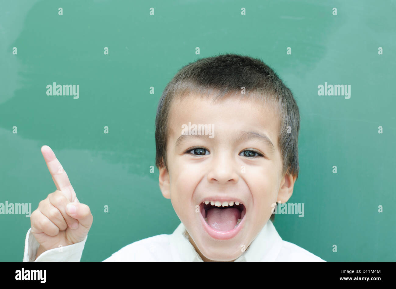 Little Boy Screaming Very Happy at Blackboard Stock Photo - Alamy