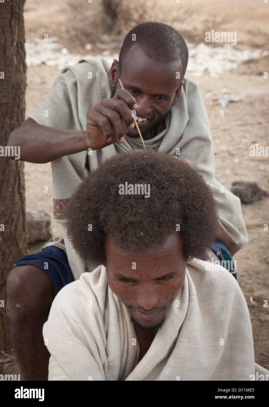 Karrayyu Tribe Man Having His Gunfura Traditional Hairstyle Done In ...