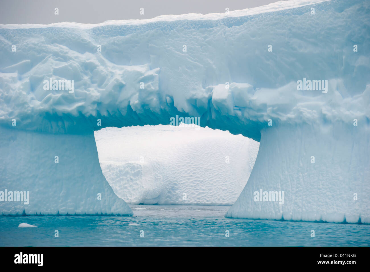 Iceberg With A Hole Through It; Antarctica Stock Photo - Alamy
