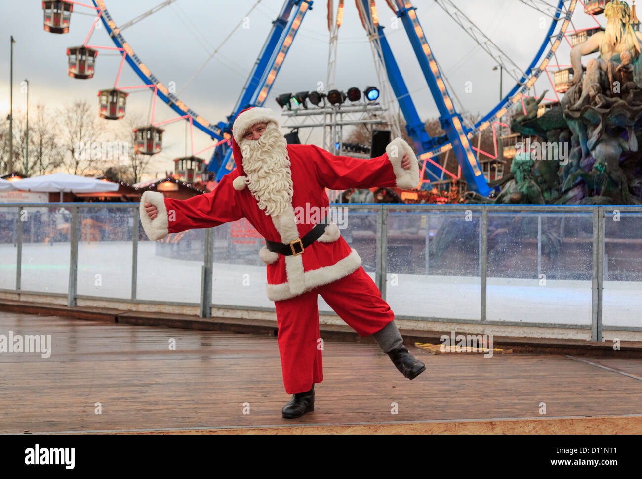 Man dressed up in a red Santa Clause suit at a Christmas market at ...