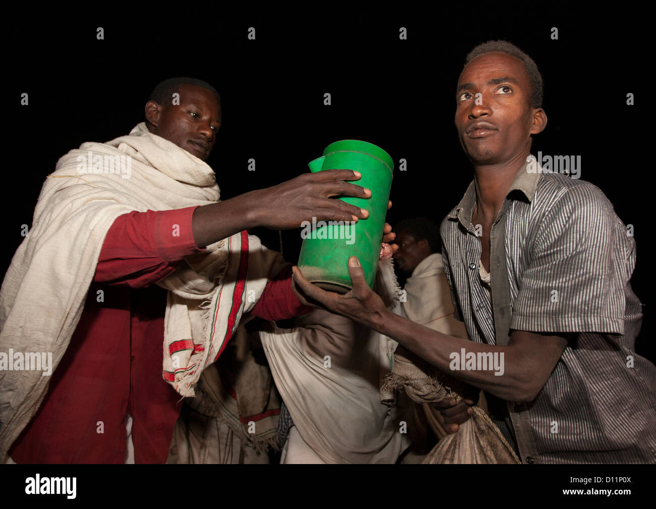 Night Shot Of A Karrayyu Tribe Man Bringing Food To Another Karrayyu ...