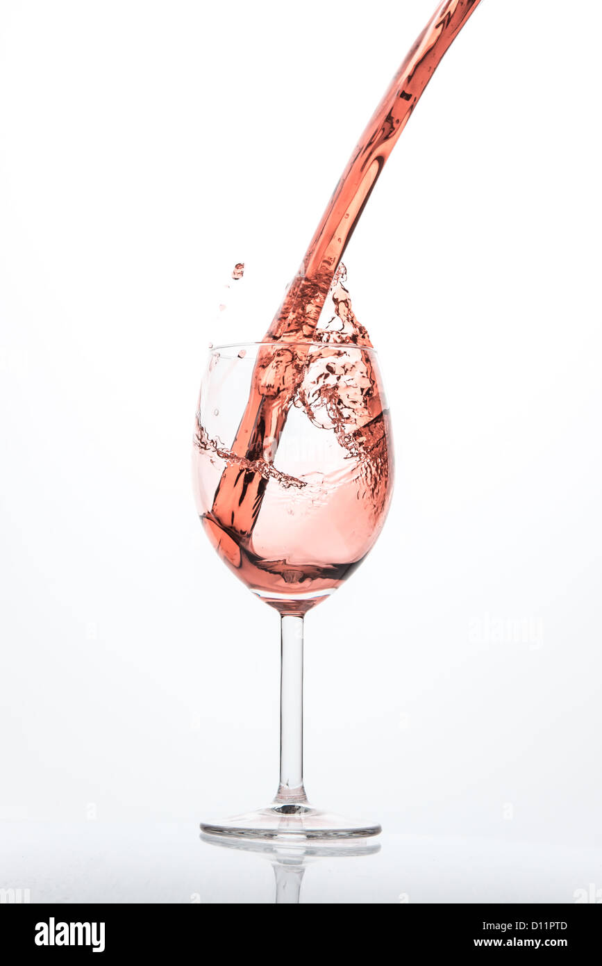 rose wine splashing on white background Stock Photo - Alamy