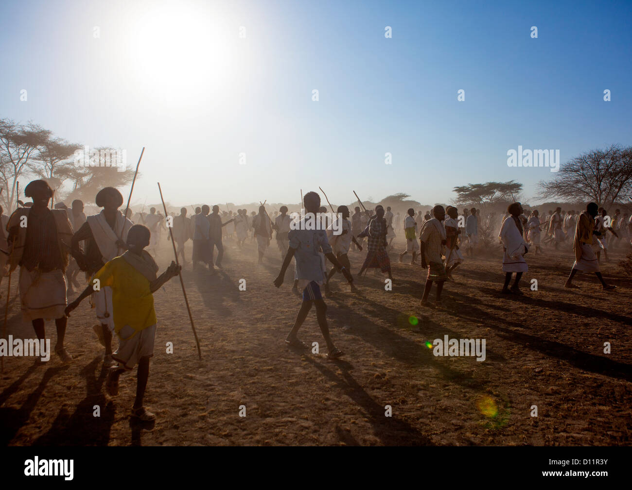 Large Group Of Karrayyu Tribe Men Walking At Sunset To Attend Stick ...