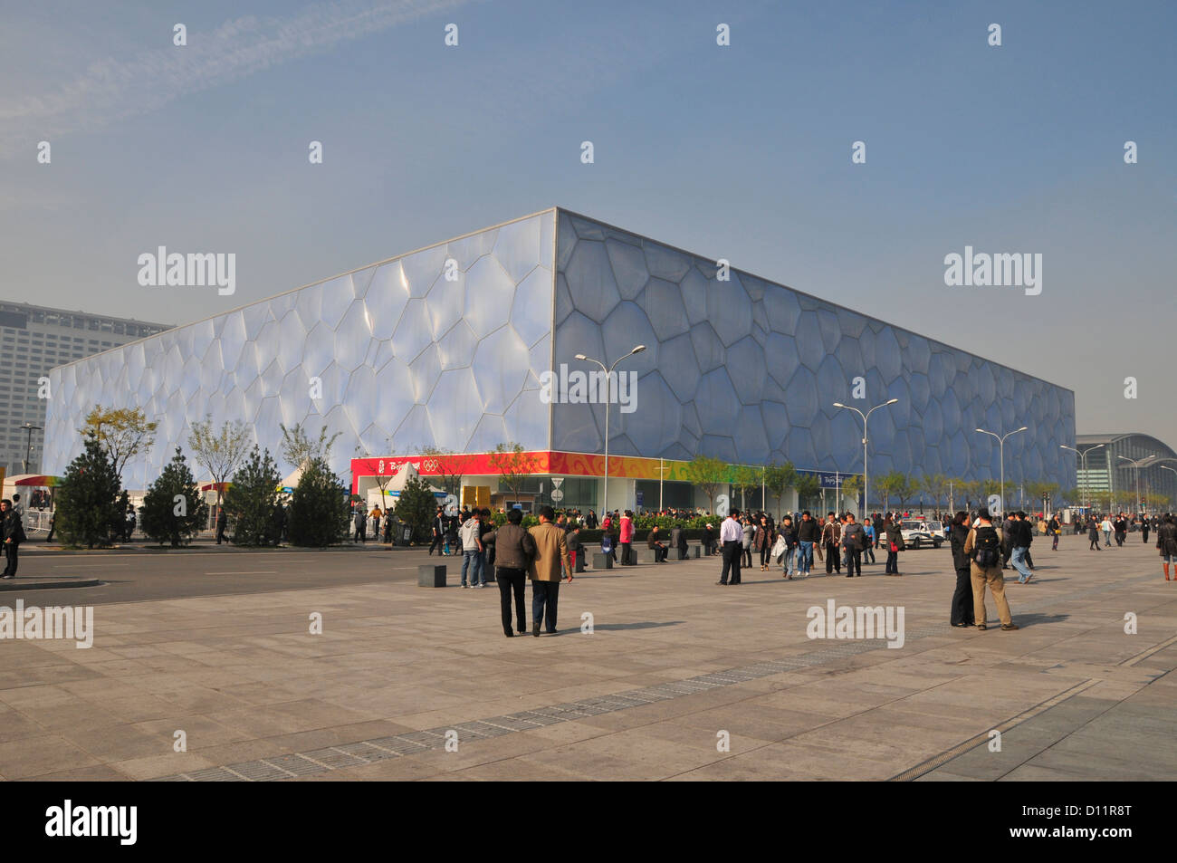 Pedestrians On A Walkway Beside A Building; Beijing China Stock Photo ...