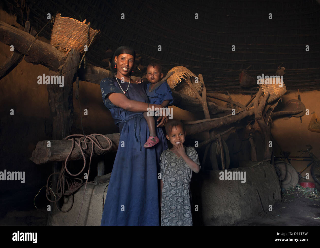 Portrait Of A Mother And Kids In Their Tukul House, Alaba, Ethiopia ...