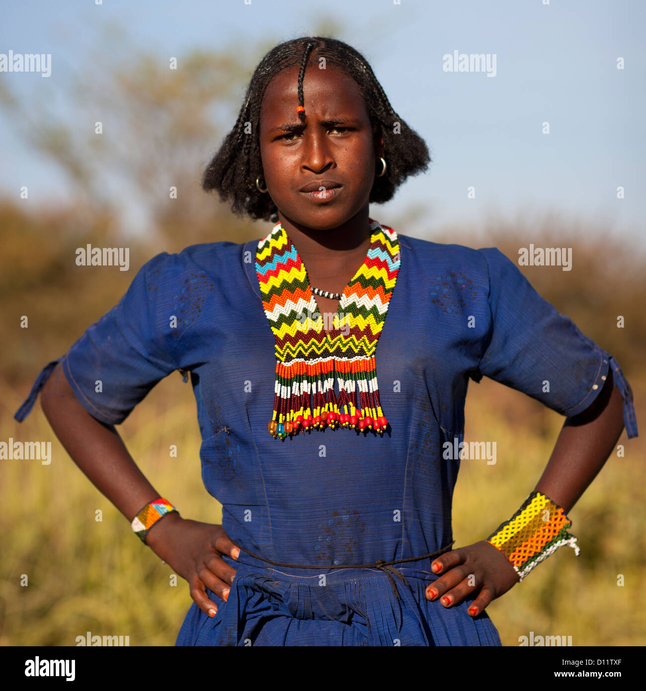 Portrait Of A Proud Oromo Tribe Woman With Stranded Hair And Colourful ...