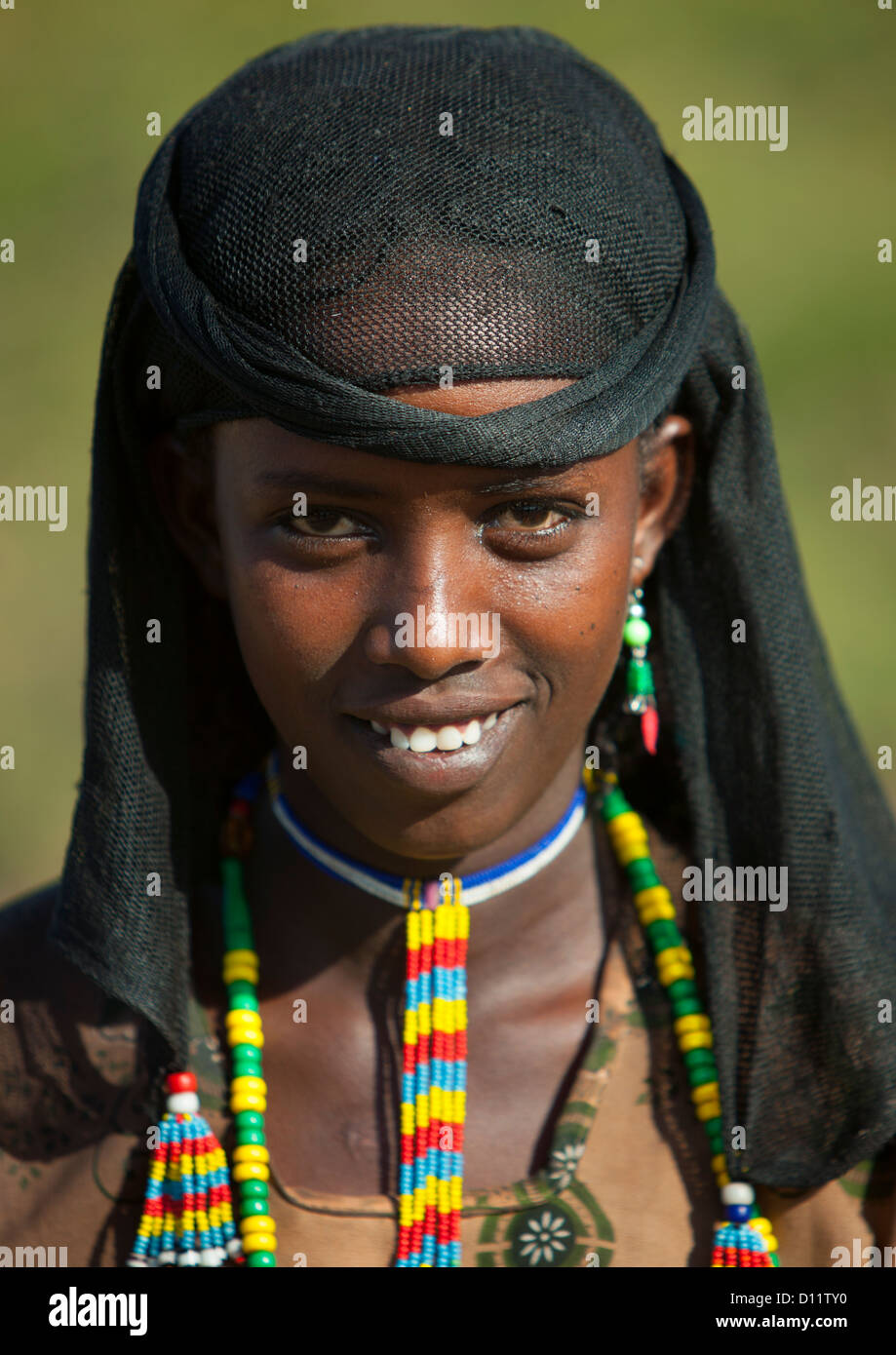 Portrait Of A Young Oromo Tribe Woman With Toothy Smile, Colourful ...