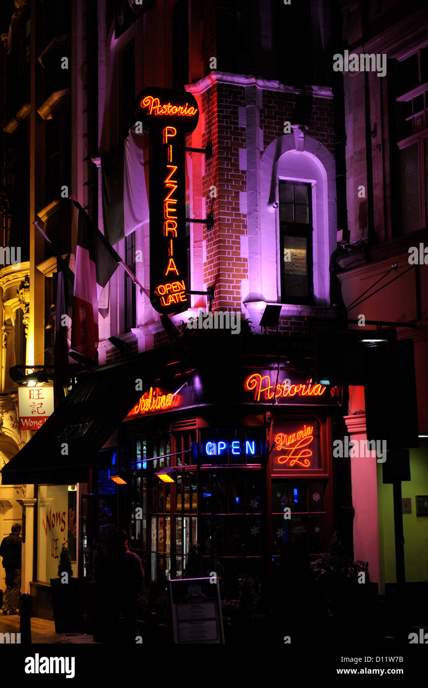 London Restaurant lit up at night with neon signs Stock Photo - Alamy