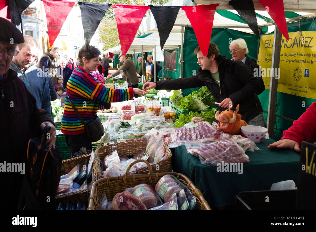 People shopping for fresh local grown organic food vegetables ...