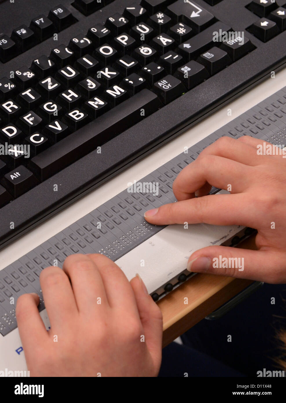 Students of the state school for the blind and visually impaired study ...
