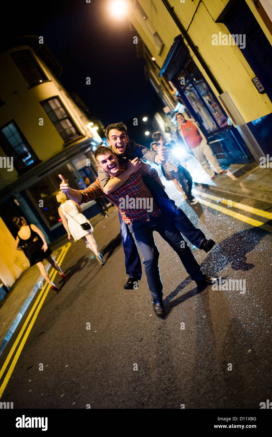 Young people out partying on a saturday night on the streets of ...