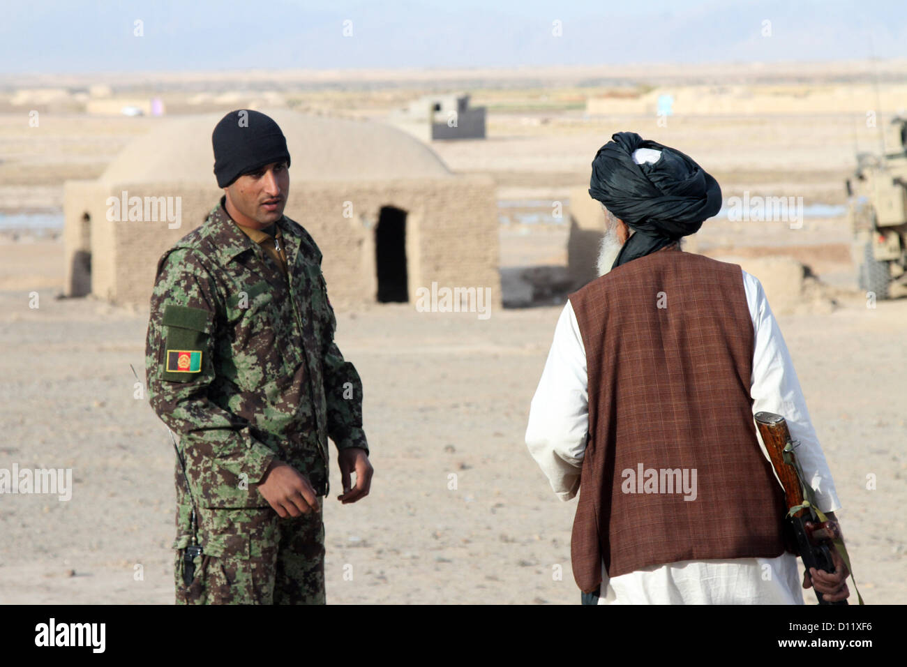 An Afghan National Army soldier speaks with an Afghan Local Police ...