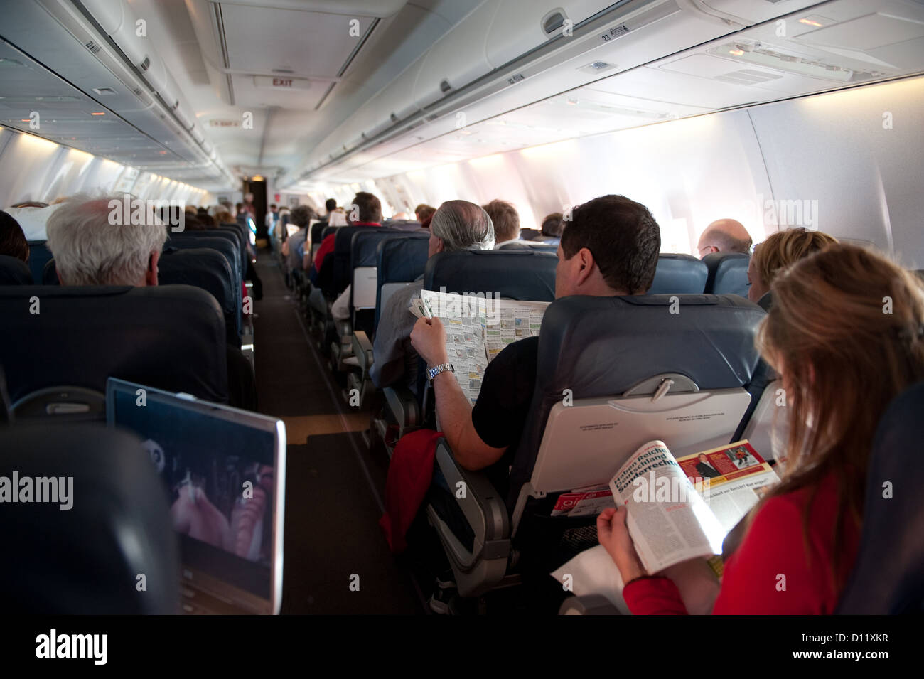 Airplane interior passengers hi-res stock photography and images - Alamy