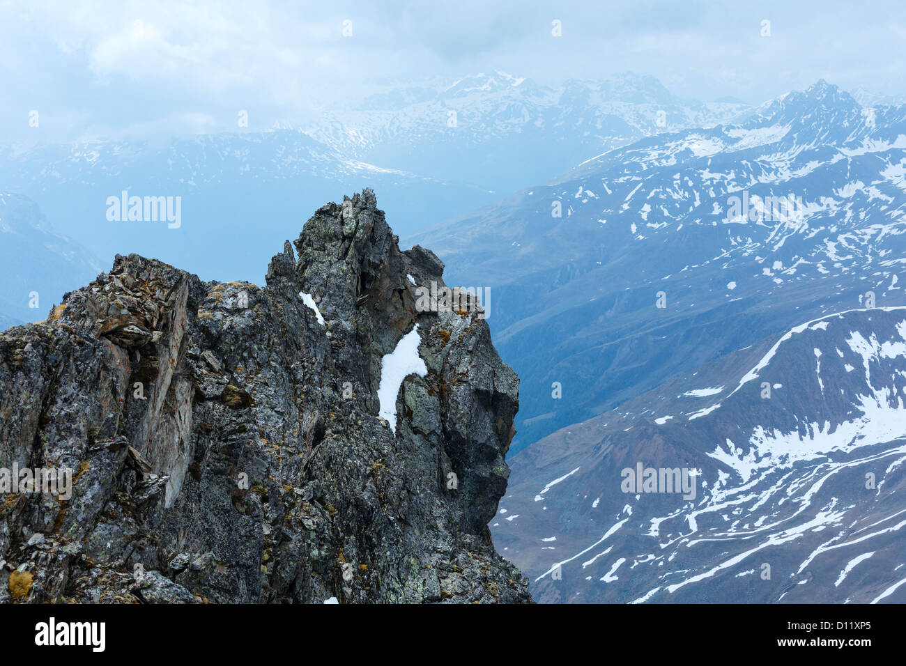 Overcast mountain view with stony rock above precipice (near Kaunertal ...