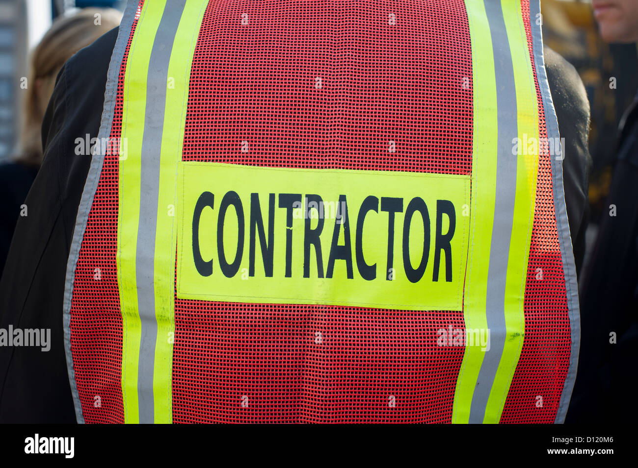 A contractor wears a safety vest at a construction site in New York ...