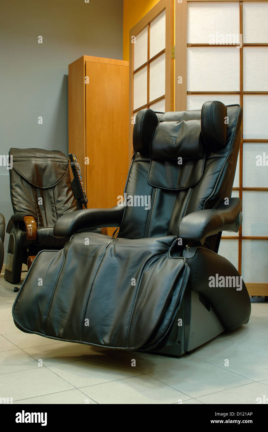black massage chair in spa room Stock Photo - Alamy