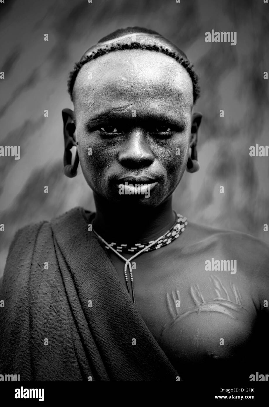 Black And White Portrait Of A Surma Tribe Warrior With Scarifications ...