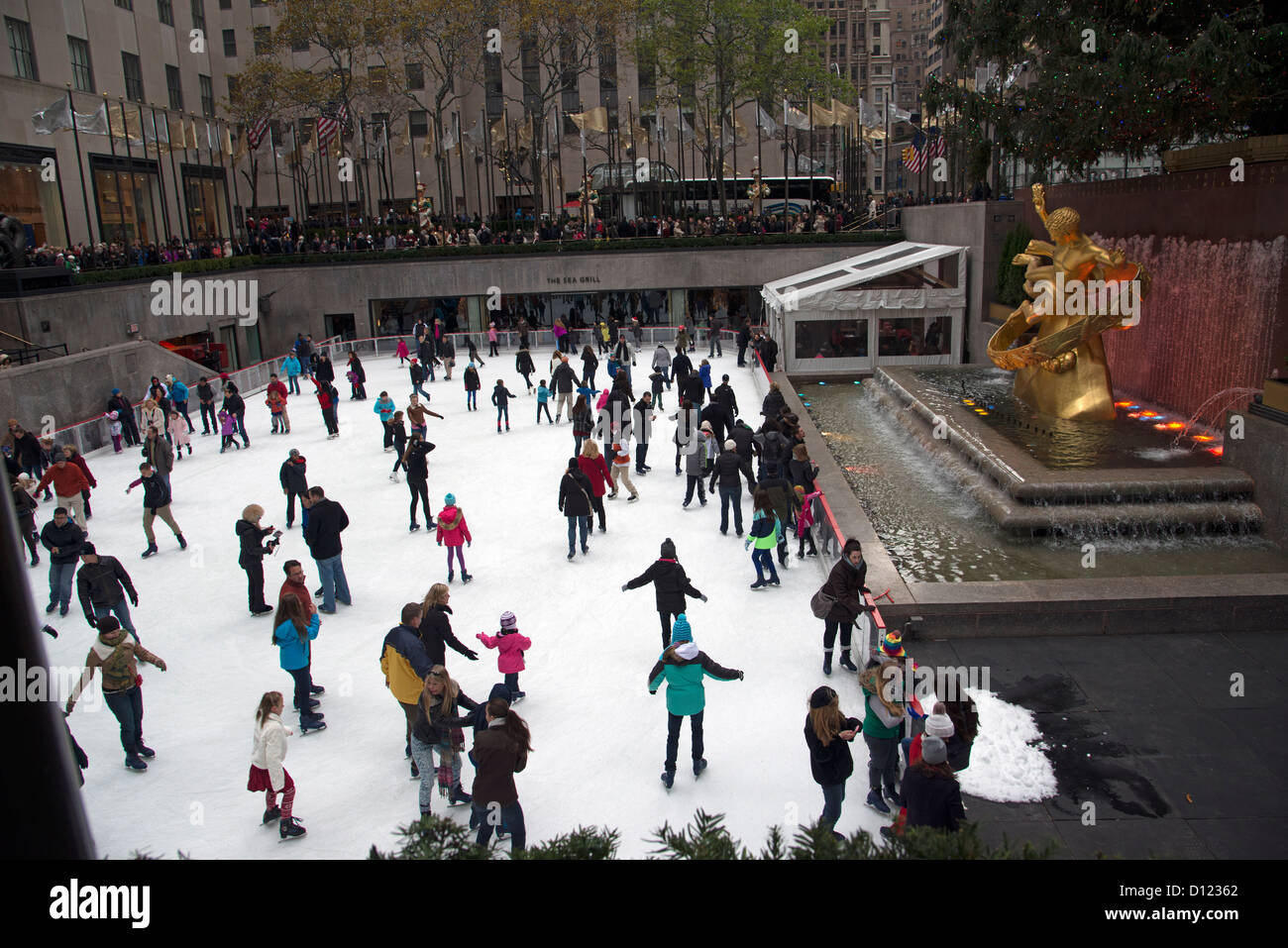 Skaters in action on the ice rink at Rockefeller Center New York USA ...