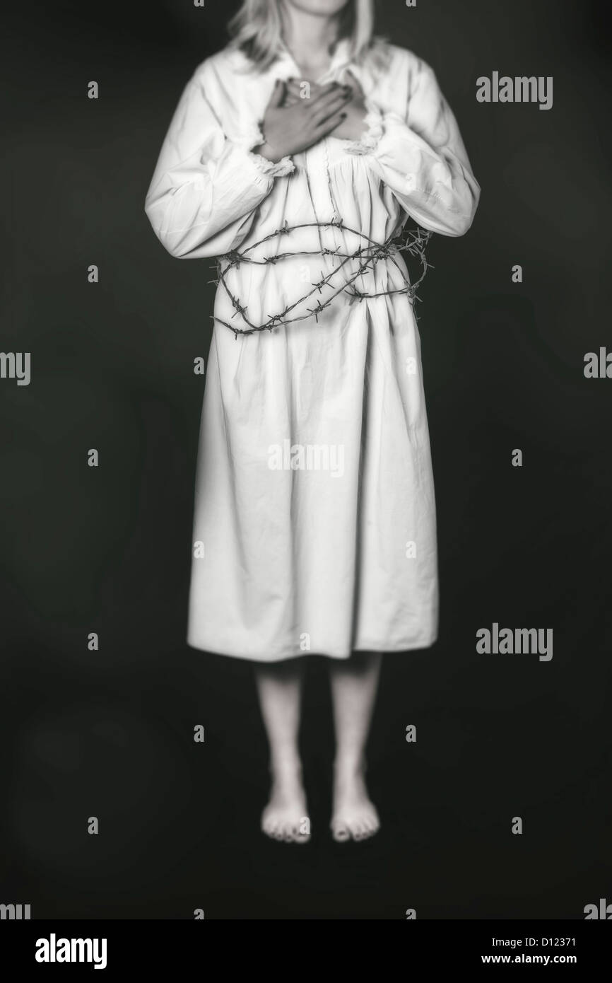a girl with a belt made of barbed wire Stock Photo - Alamy