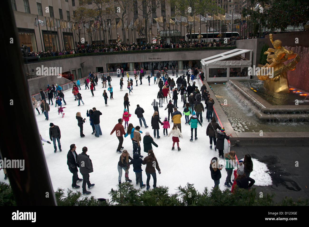 Skaters in action on the ice rink at Rockefeller Center New York USA ...