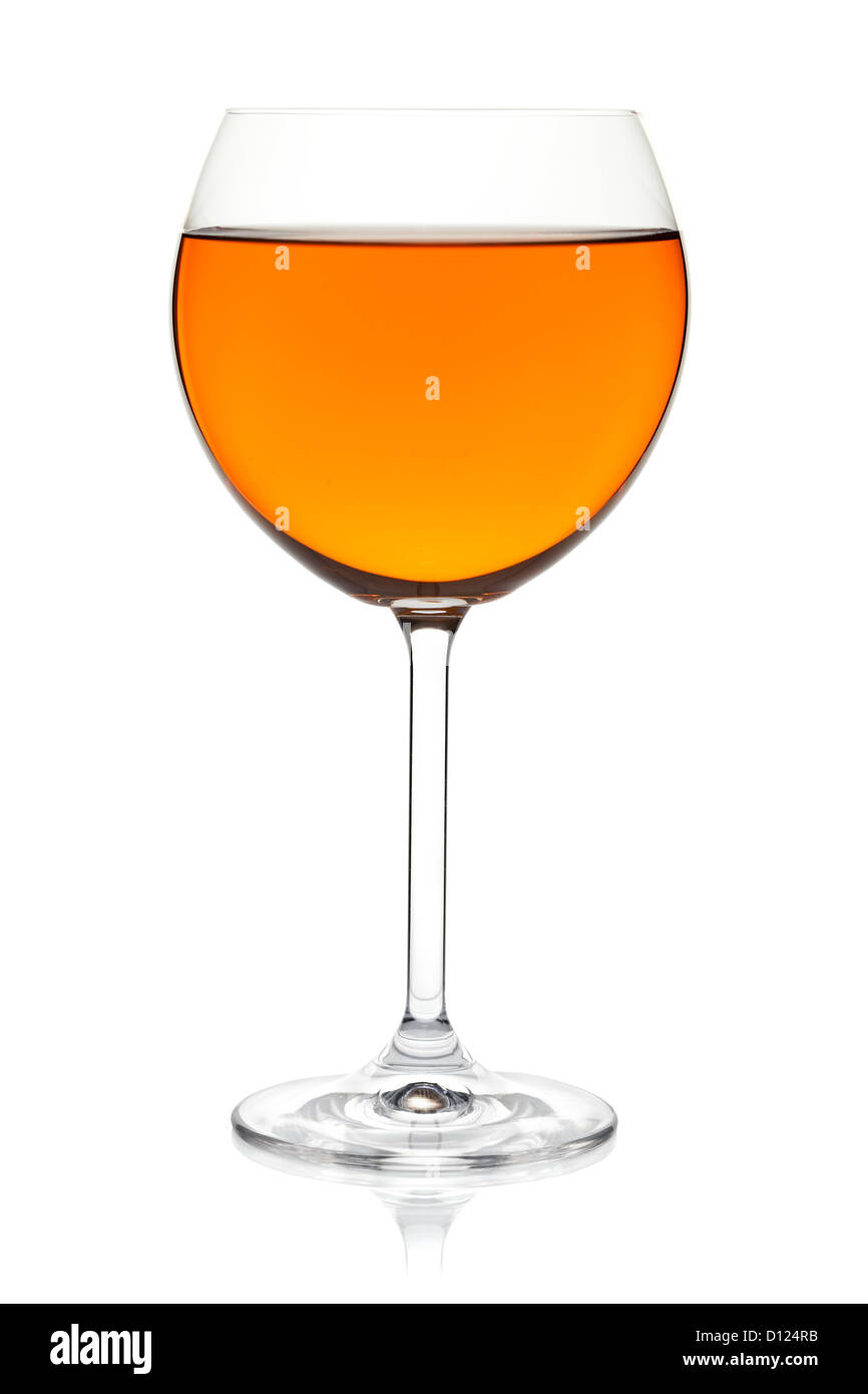 Orange color drink in wine glass. Isolated on white background Stock ...