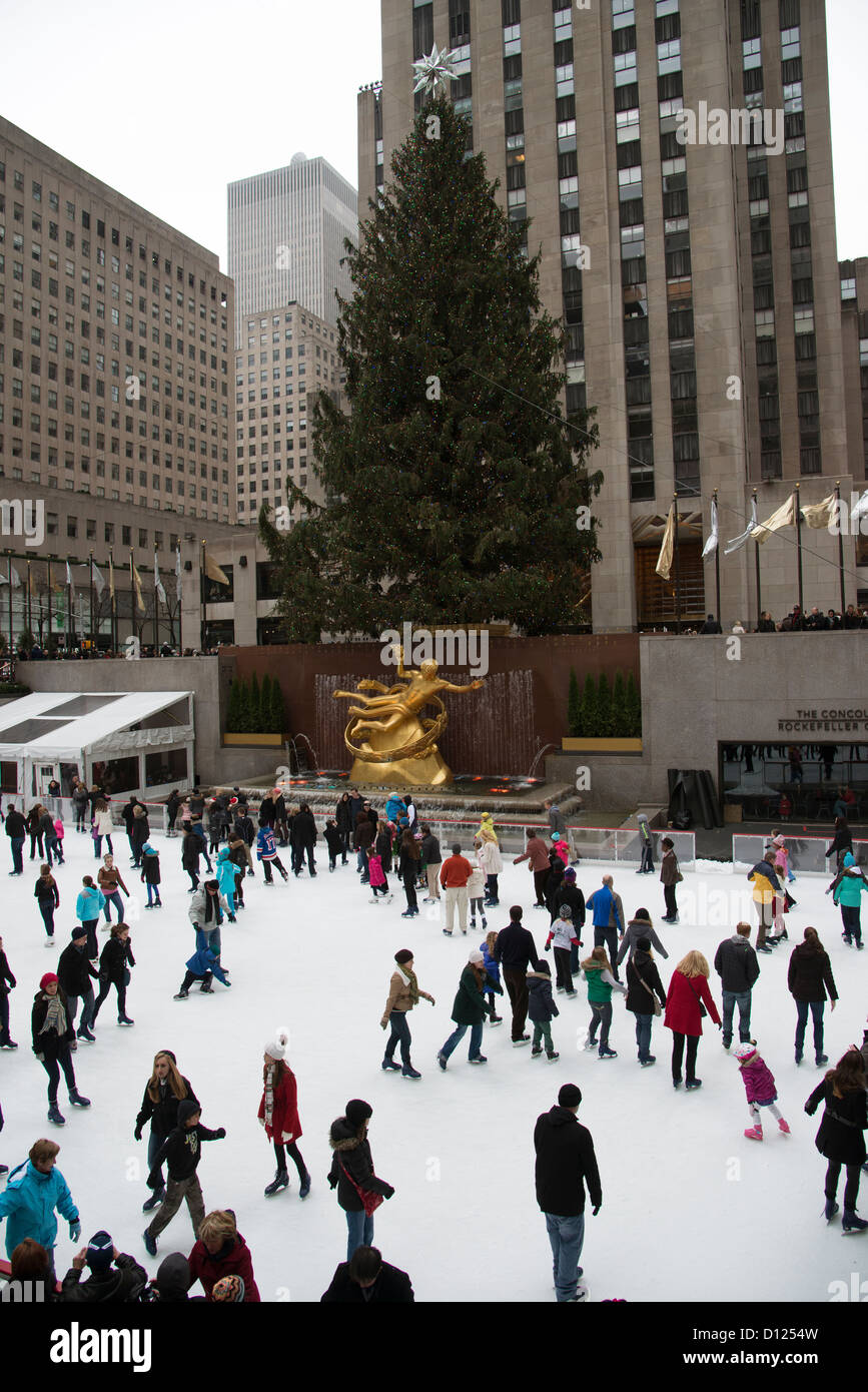 Skaters in action on the ice rink at Rockefeller Center New York USA ...