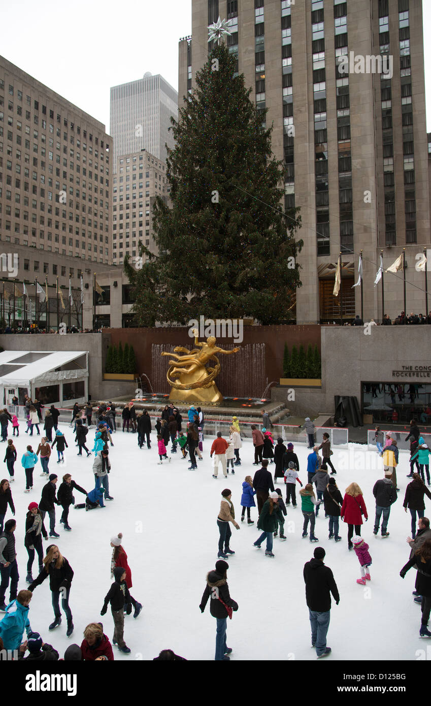 Skaters in action on the ice rink at Rockefeller Center New York USA ...