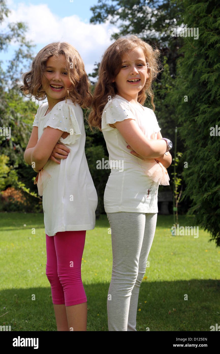 Sisters back back arms crossed hi-res stock photography and images - Alamy