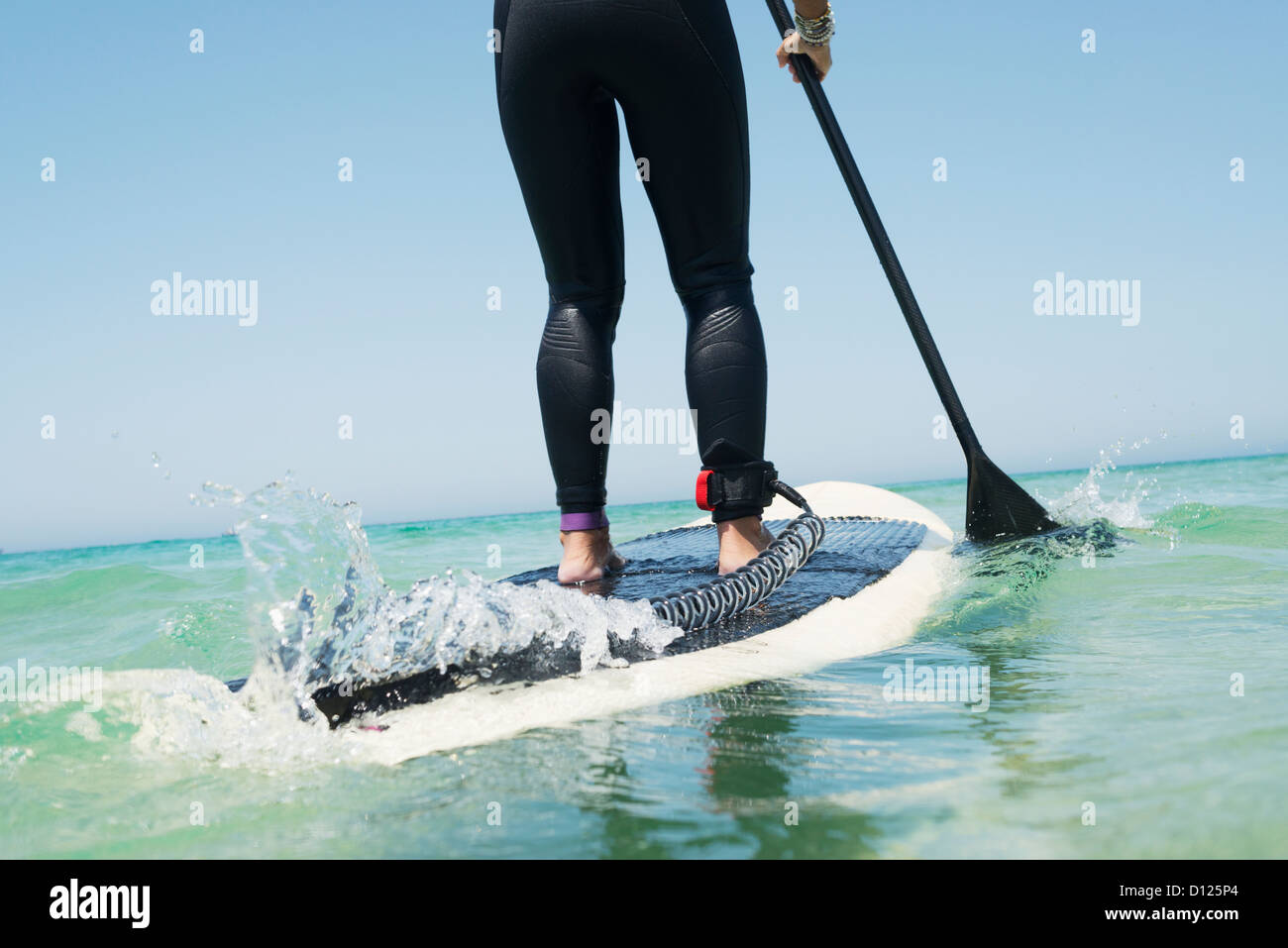 Legs of woman on surfboard hi-res stock photography and images - Alamy