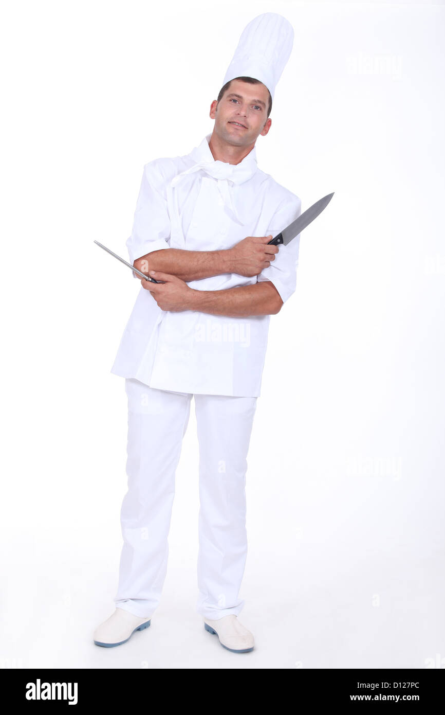 Cook with two knives Stock Photo - Alamy