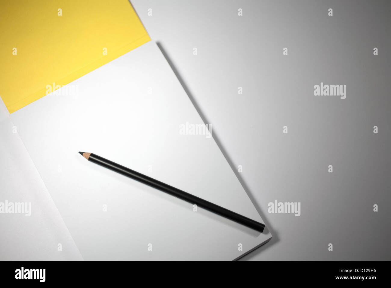empty blocknote with black pensil Stock Photo - Alamy