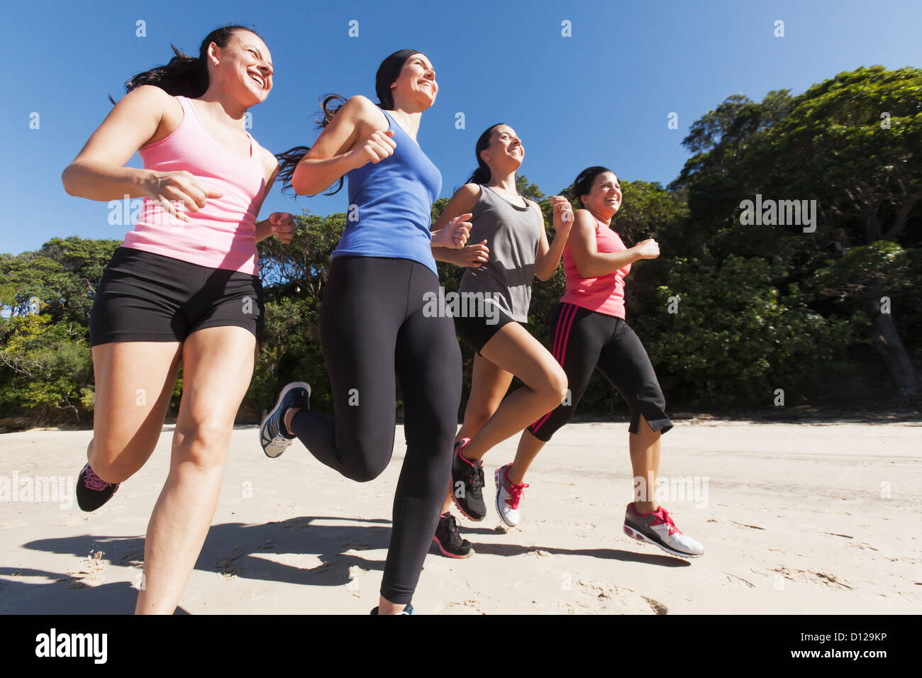 Four Women Running; Gold Coast Queensland Australia Stock Photo - Alamy