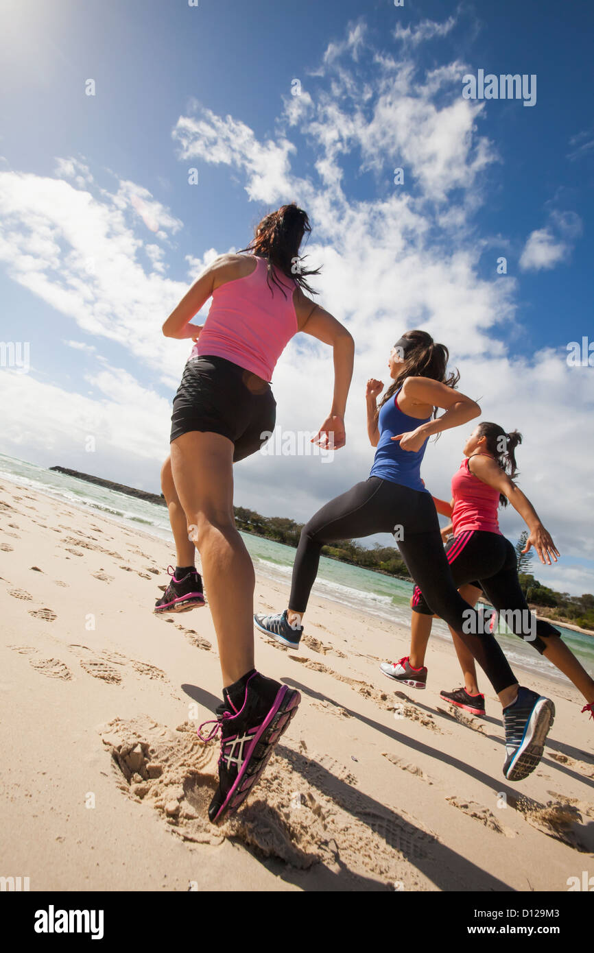 Four Women Running; Gold Coast Queensland Australia Stock Photo - Alamy