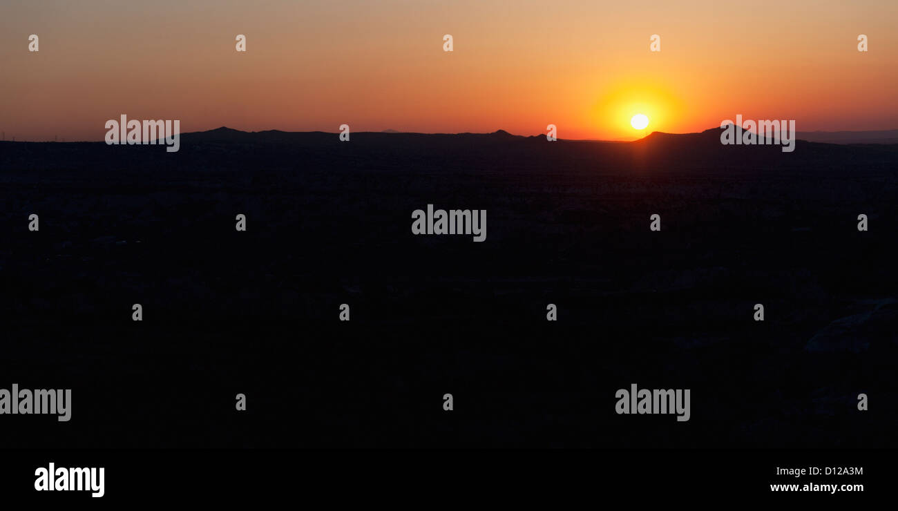 Silhouette Of The Landscape And An Orange Horizon With A Glowing Sun At ...