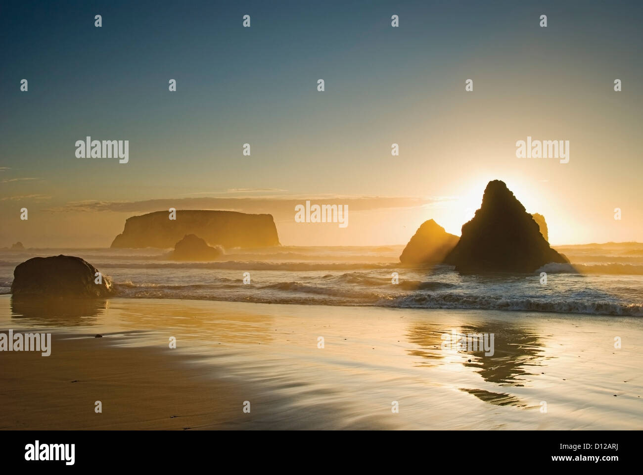 Sunset Behind Offshore Rocks; Bandon Oregon United States Of America ...