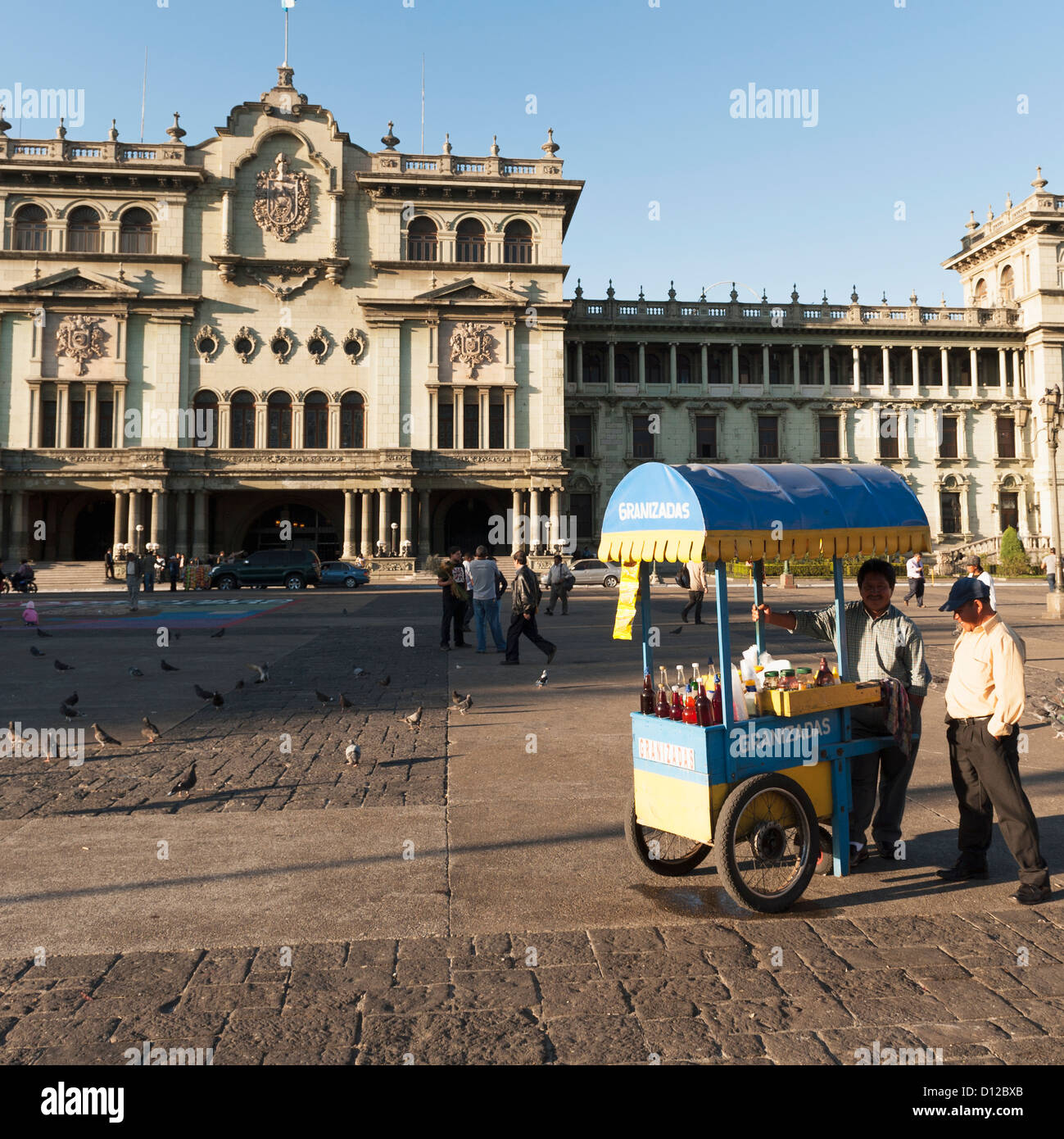 Two Men Selling Beverages At A Cart In A Town Square; Guatemala City ...