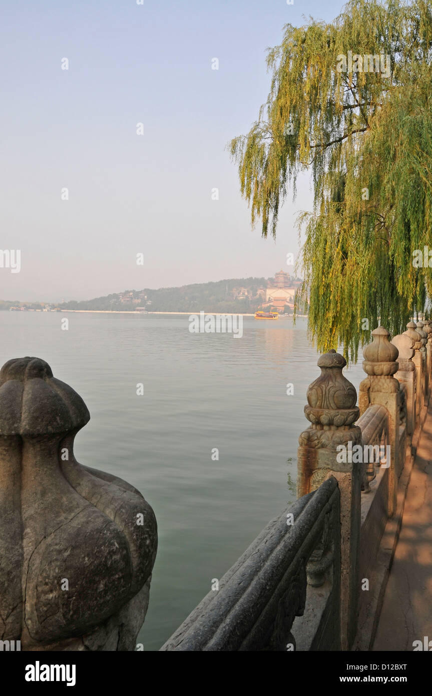 A Tree And Ornate Balusters On A Railing On The Water's Edge; Beijing ...