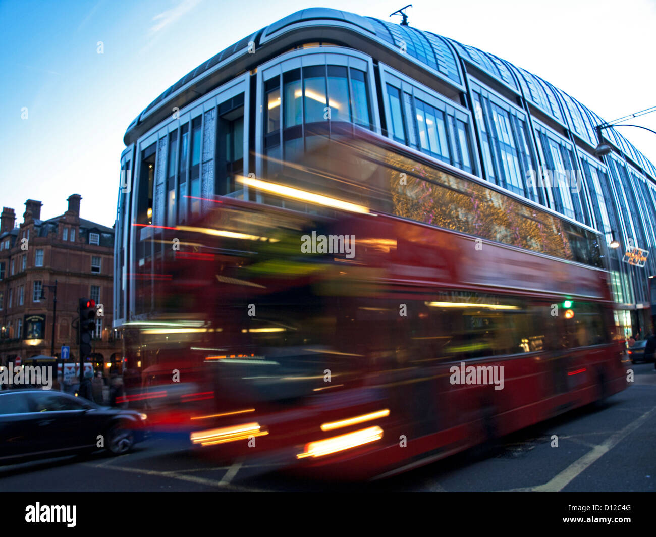 Moving bus on Oxford Street showing modern architecture in background ...