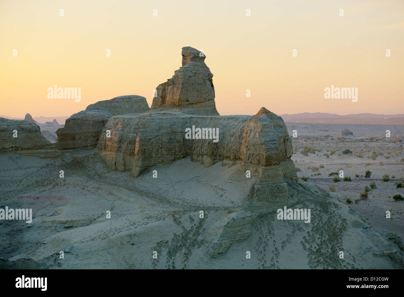 xinjiang, china: human-shaped rock in gobi desert Stock Photo - Alamy