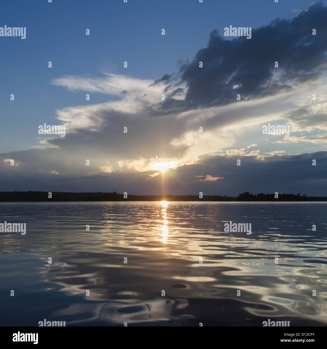 Sunlight Reflecting On Lake Water At Sunset; Lake Of The Woods Ontario ...