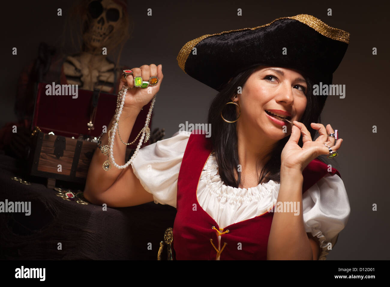 Dramatic Female Pirate Biting a Coin in a Dimly Lit Moody Scene Stock ...