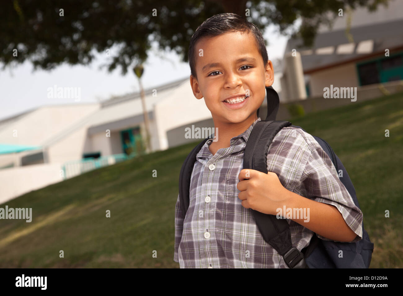 Happy Young Hispanic Boy with Backpack Ready for School Stock Photo - Alamy
