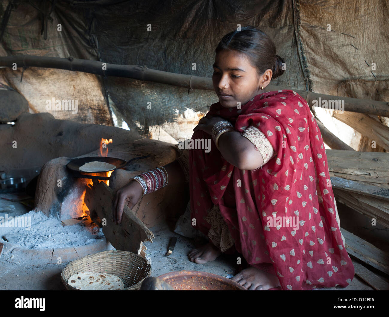 Young Indian woman preparing food at home Stock Photo - Alamy