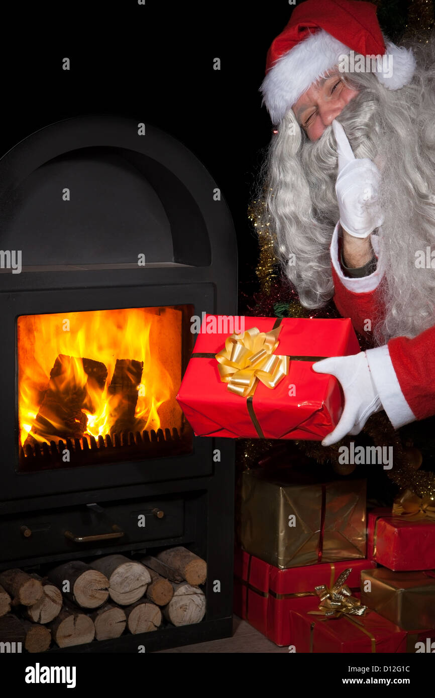 Santa Claus with a gift Stock Photo - Alamy