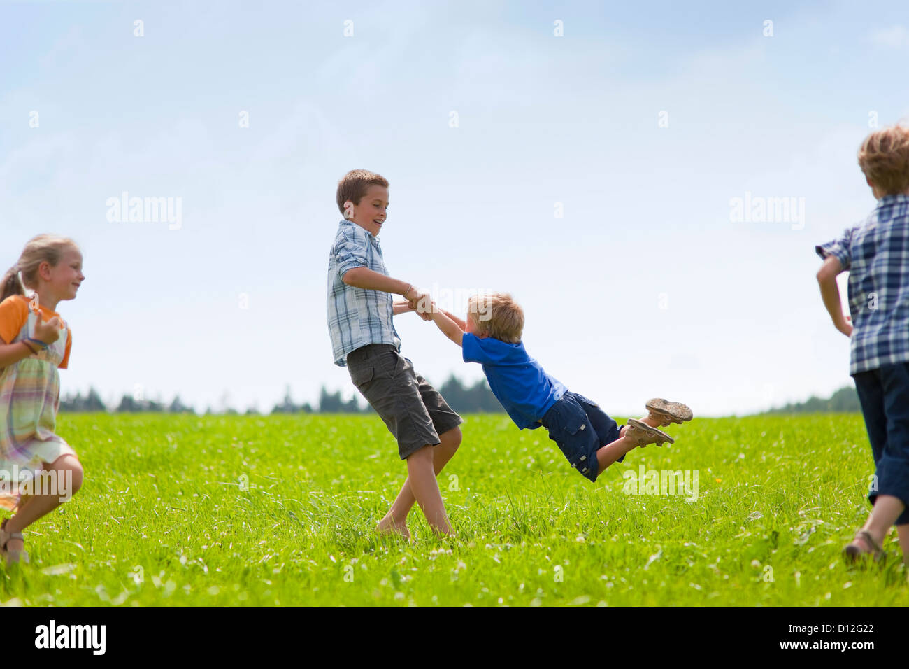 Germany, Bavaria, Group of children playing in meadow Stock Photo - Alamy