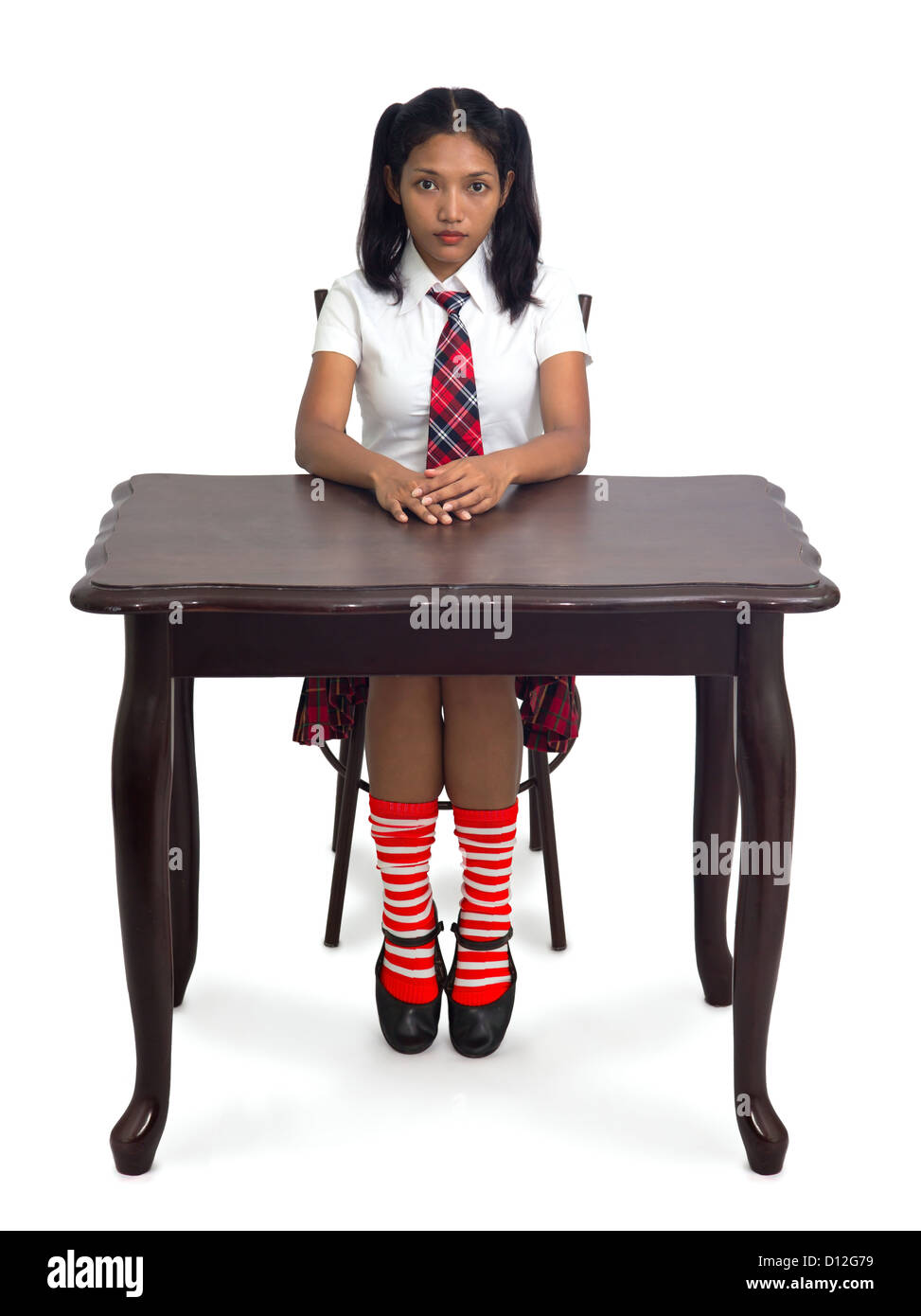 Student sitting at a desk Stock Photo - Alamy
