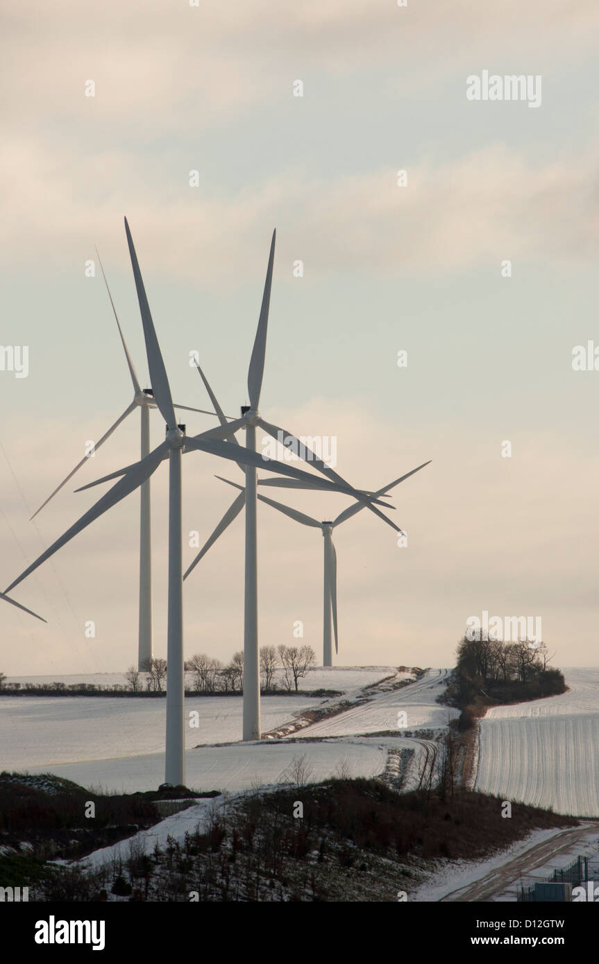 Wind farm on farm land in winter snow Wadlow Cambridgeshire Stock Photo ...