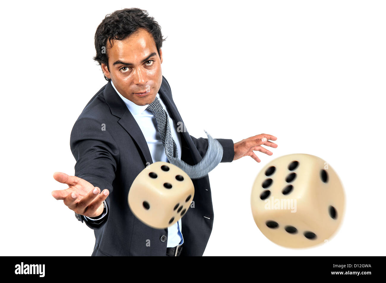 Man in a suit playing dice isolated in white Stock Photo - Alamy