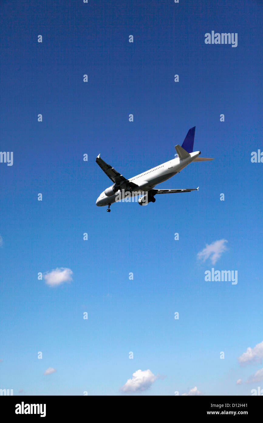 Germany, Berlin, Passenger plane flying in air at Tegel Stock Photo - Alamy